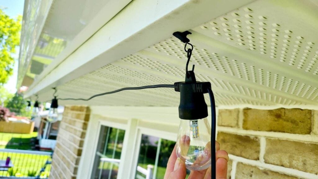The Best Hack to Hang Outdoor String Lights From a Gutter - Ahna Fulmer